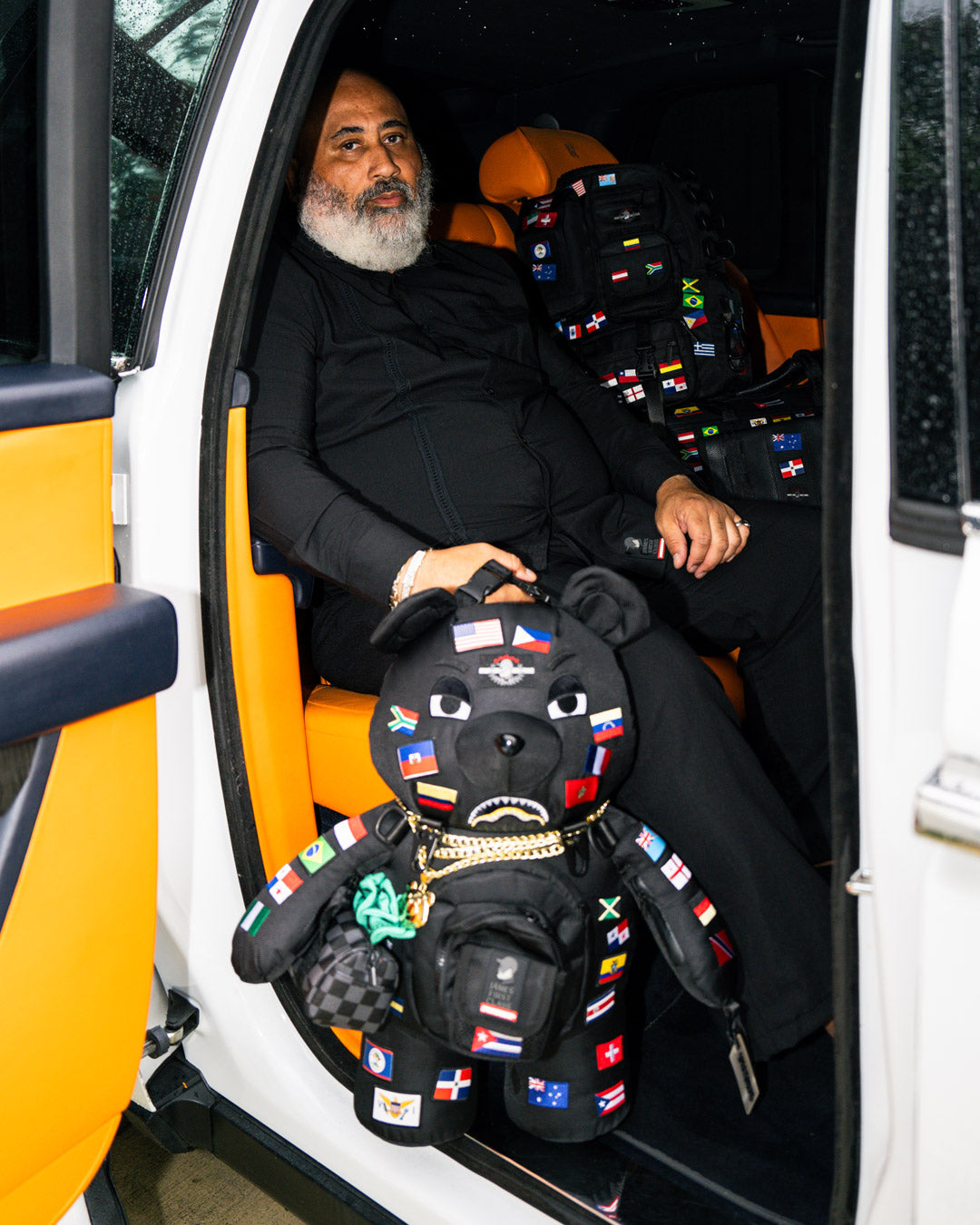 JAMES FIRST CLASS GLOBAL FLAGS MONEYBEAR BACKPACK – SPRAYGROUND®